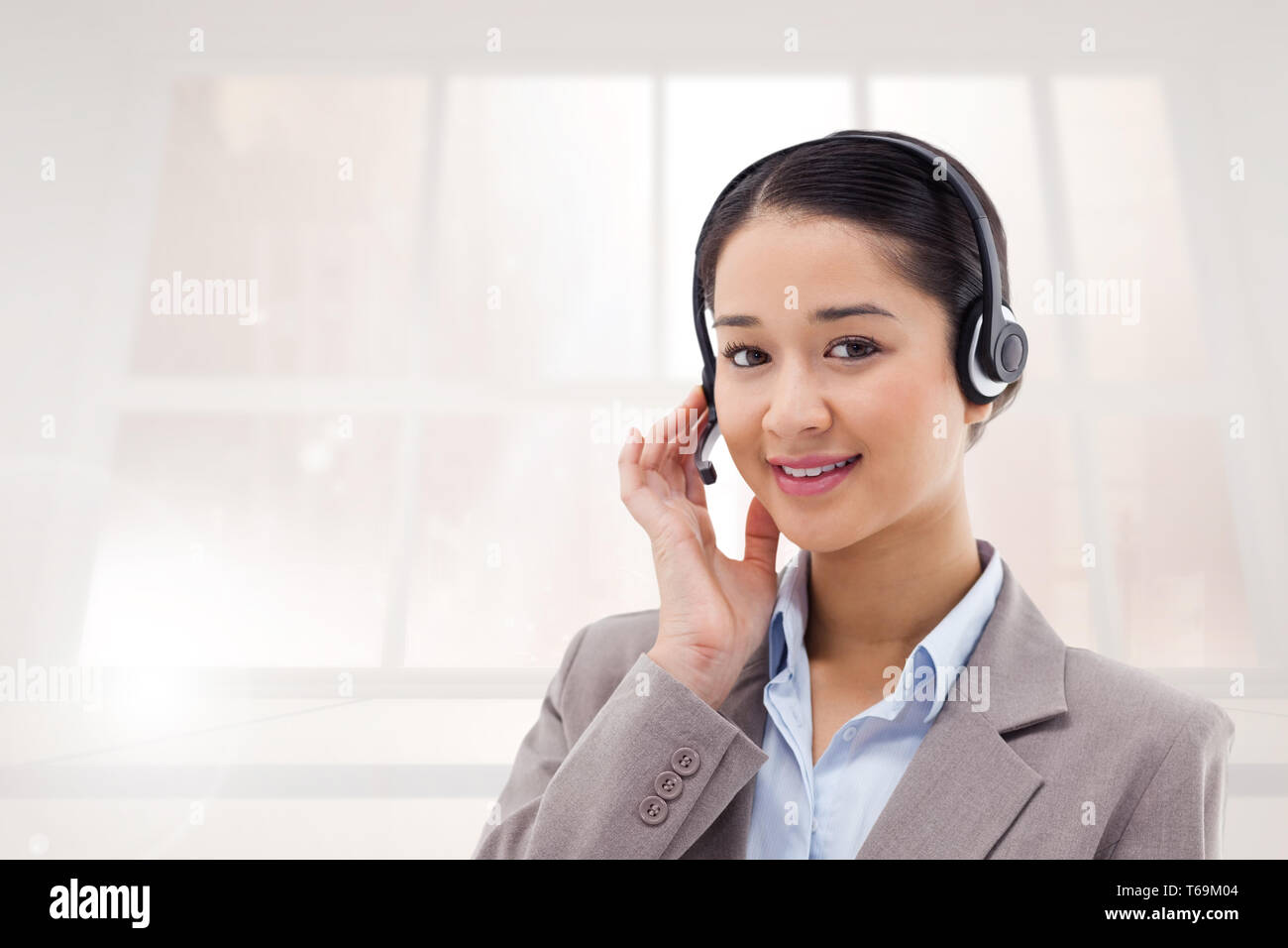 Composite image of portrait of a good looking operator posing with a ...