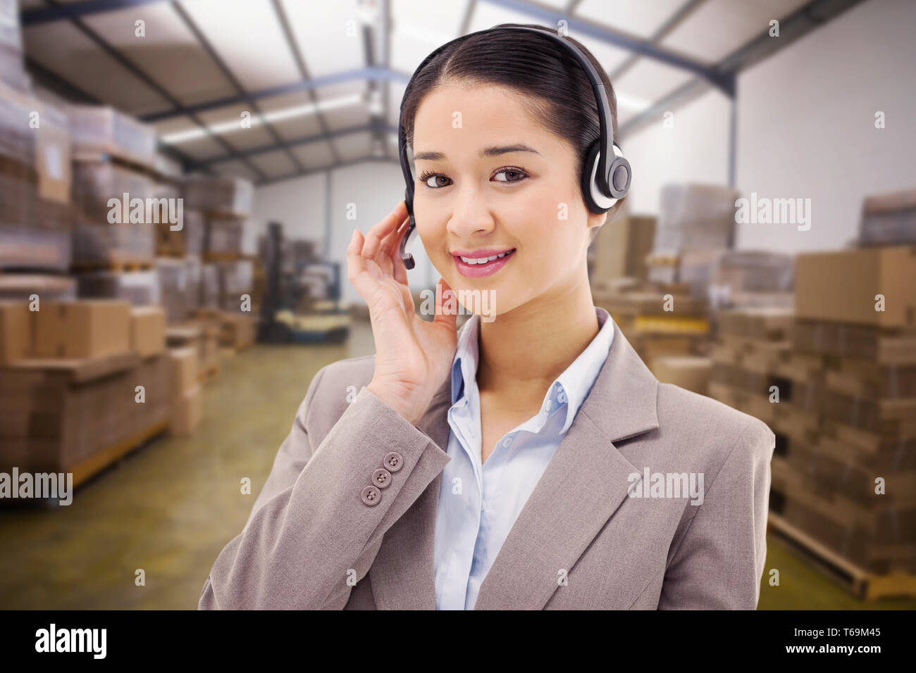 Composite image of portrait of a good looking operator posing with a ...