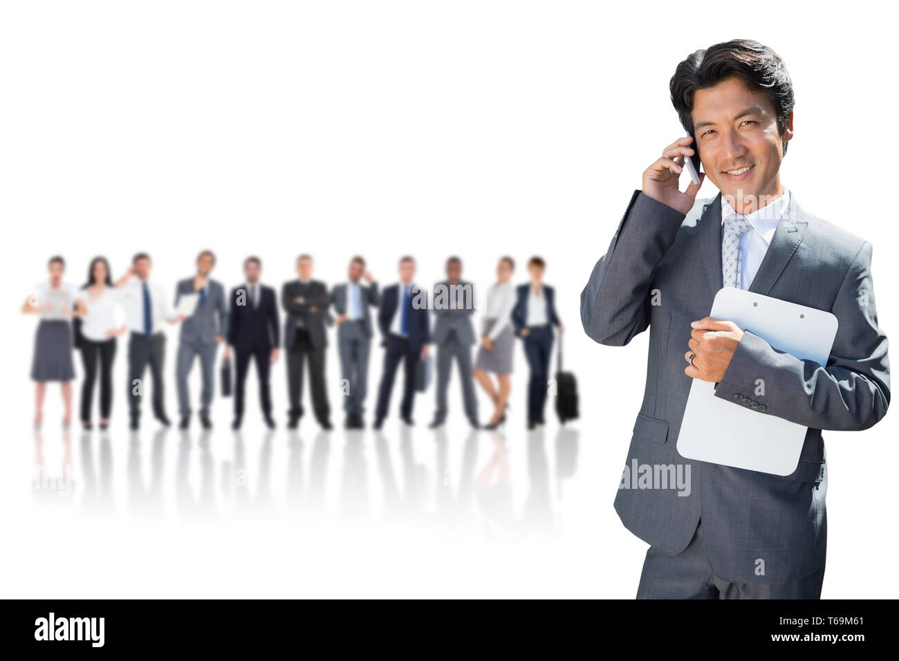 Composite image of confident estate agent standing at front door on the ...