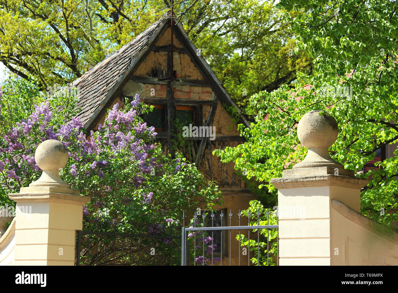 Old house an a gate Stock Photo - Alamy