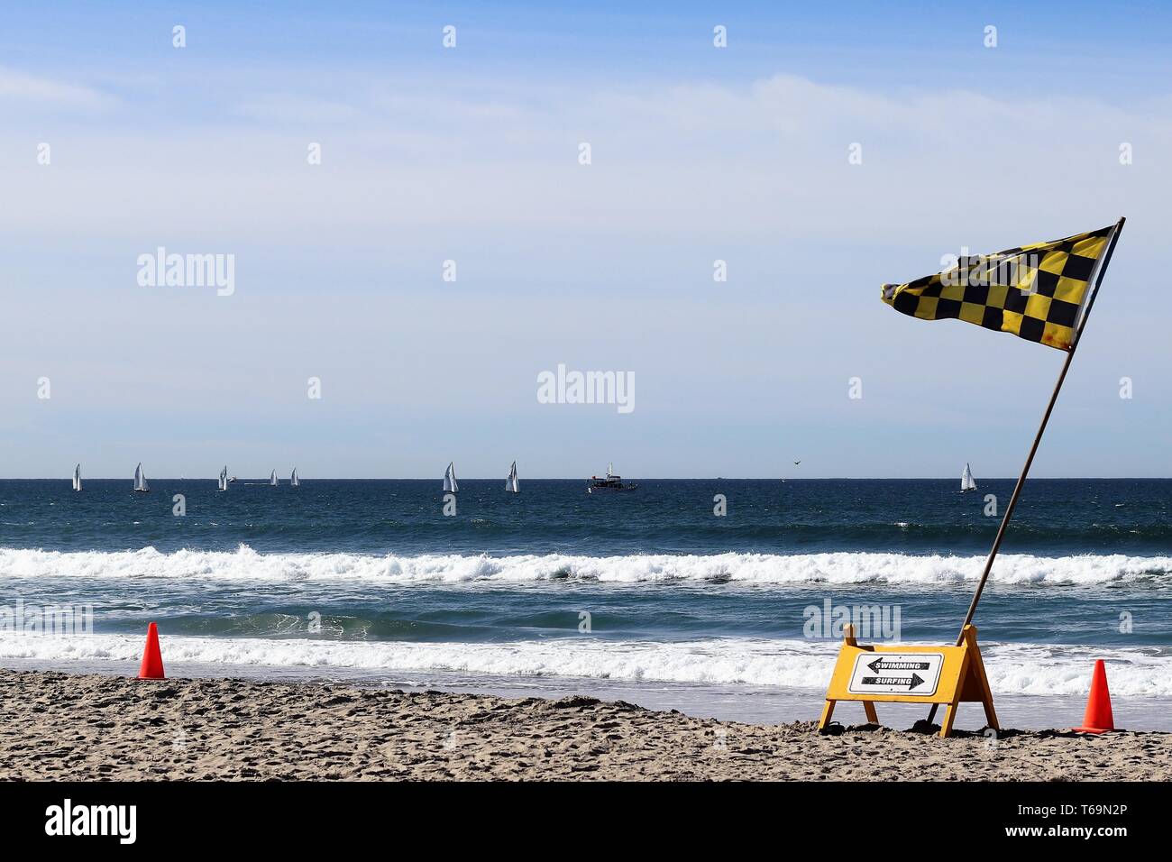 Beach Flag warning in Mission Beach, CA Stock Photo - Alamy