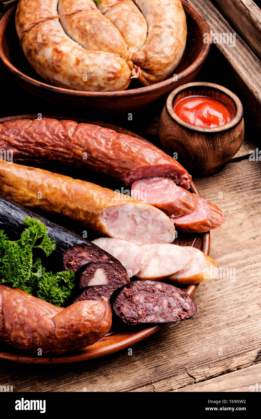 Delicious snack salami.Food tray with delicious sausages and fresh ...