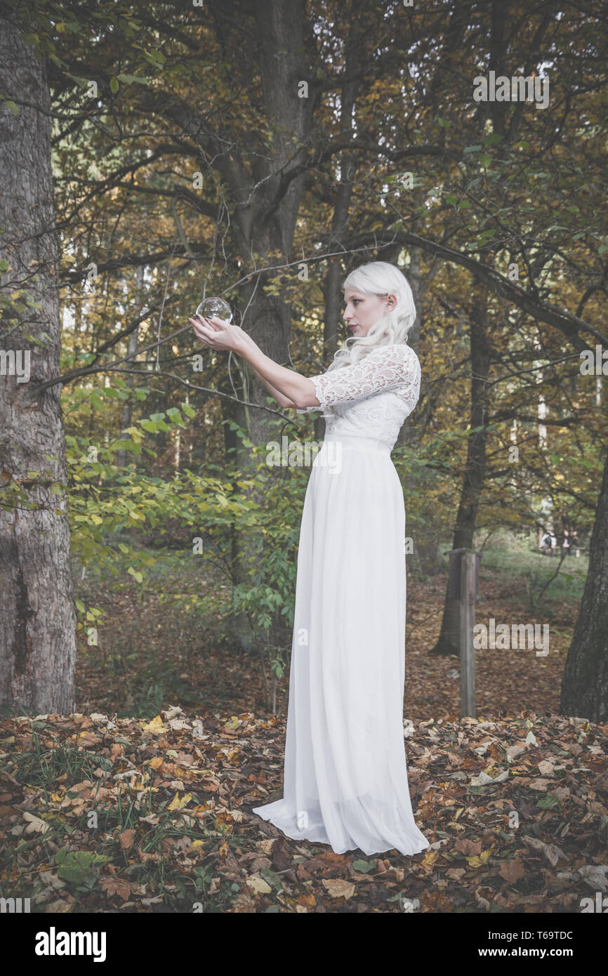 Beautiful tall fortune teller woman in the woods Stock Photo - Alamy