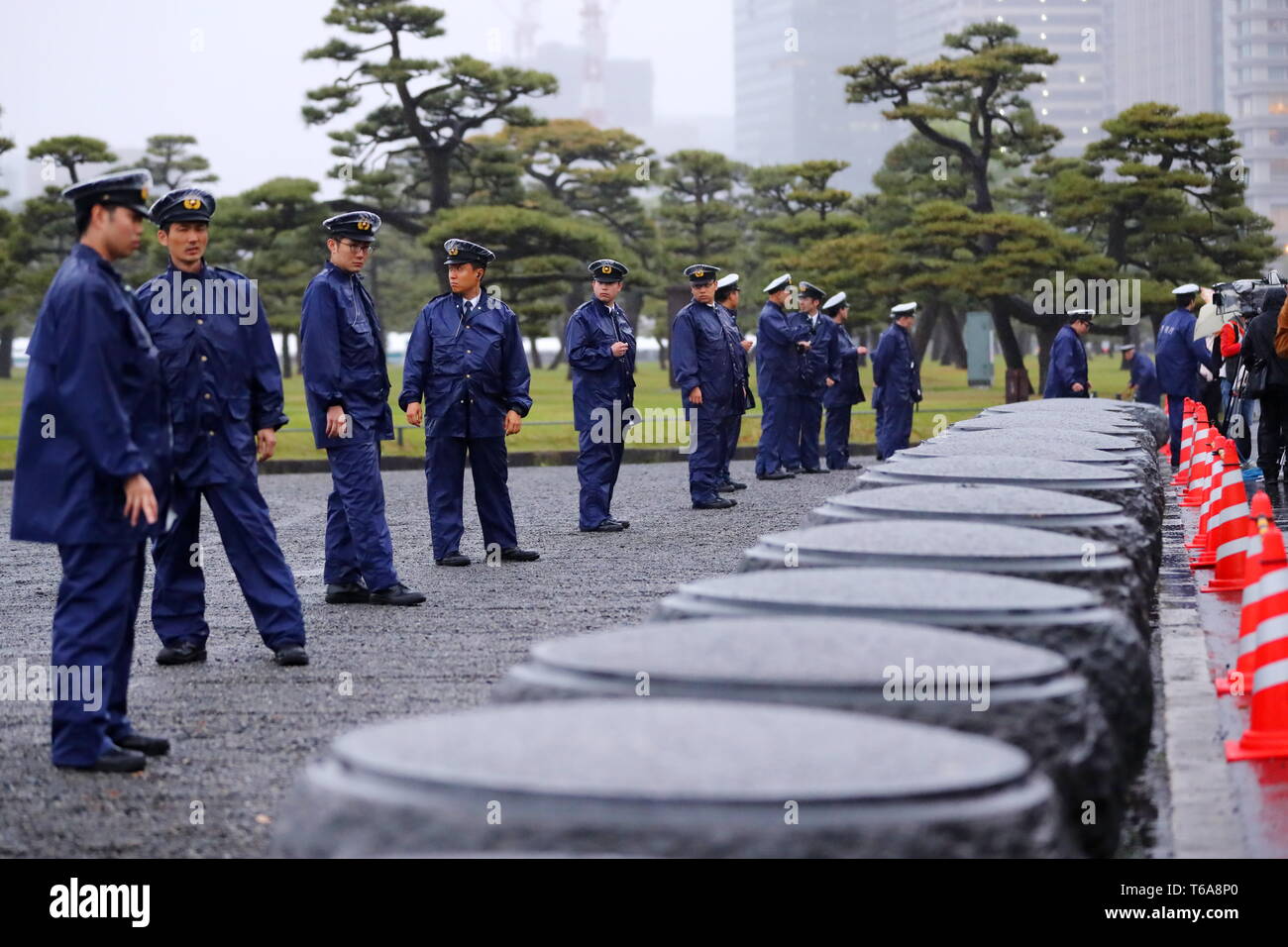 Police officers stand guard outside the Imperial Palace in Tokyo, Japan ...