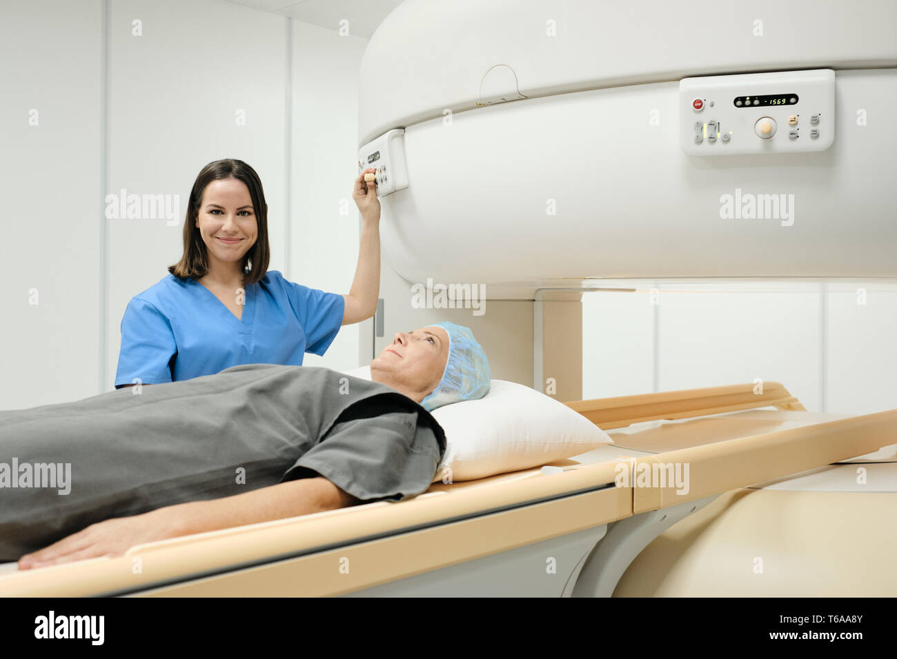 Portrait Of Friendly Successful Doctor Smiling At Camera During Mri ...