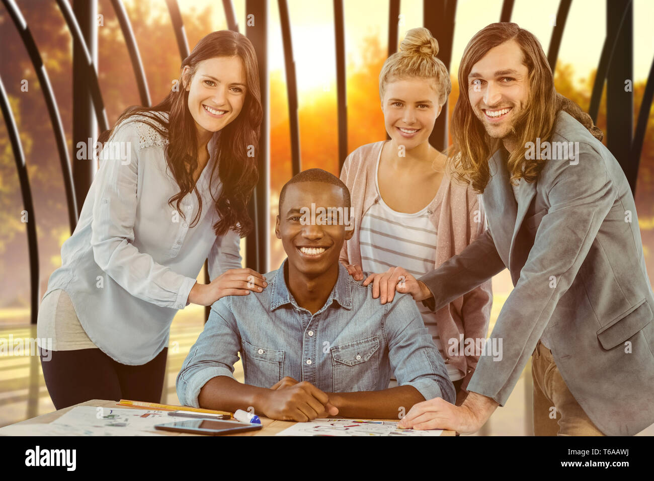 Composite image of portrait of smiling business team putting hands on ...