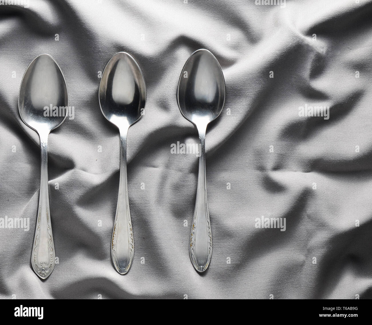 Closeup three silver spoons hi-res stock photography and images - Alamy