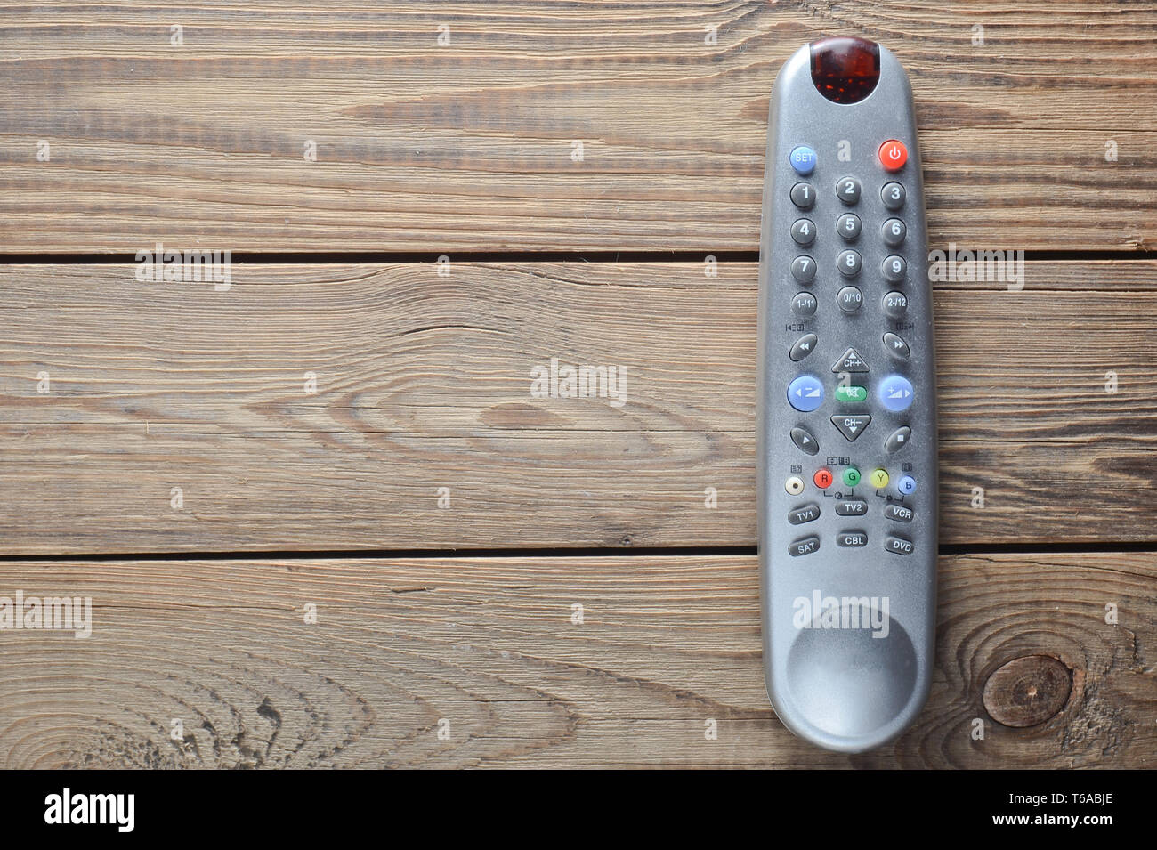 TV remote control on a wooden table. Copy space. Top view Stock Photo ...