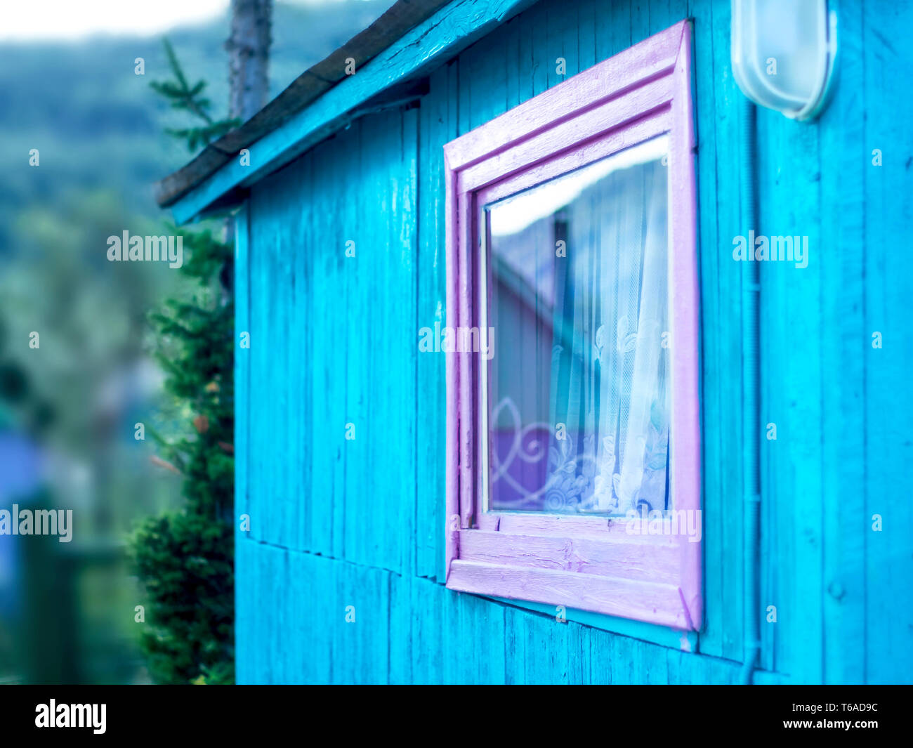 Minimalist Design Concept: Vivid Purple Window Frame, a Light on Blue ...