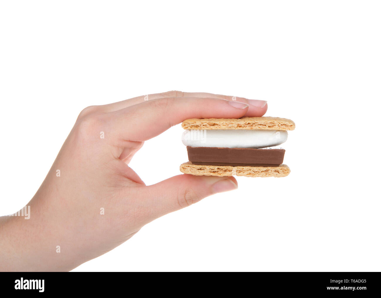 Young caucasian female hand holding s'more, isolated on white ...