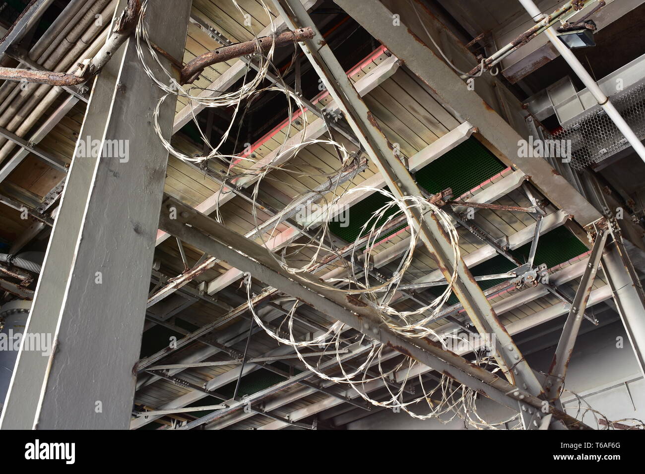 Steel construction of road bridge with barbed wire to prevent intruders ...