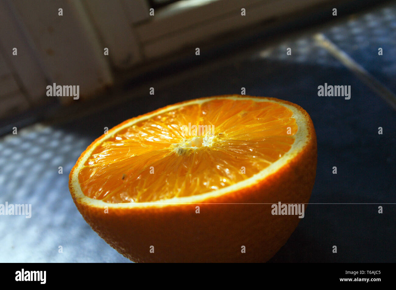 Orange fruit cut in half hi-res stock photography and images - Alamy