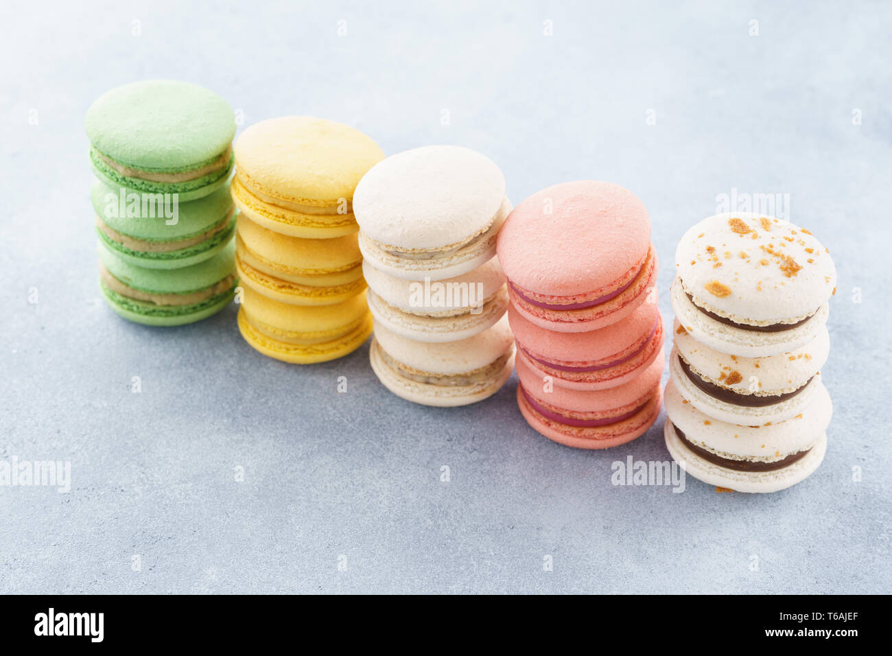 Stacks of colorful macarons with various fillings in a row Stock Photo ...