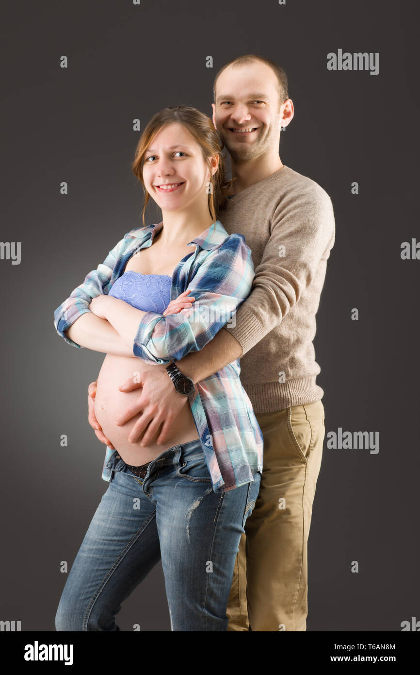 Portrait of a happy pregnant couple Stock Photo - Alamy