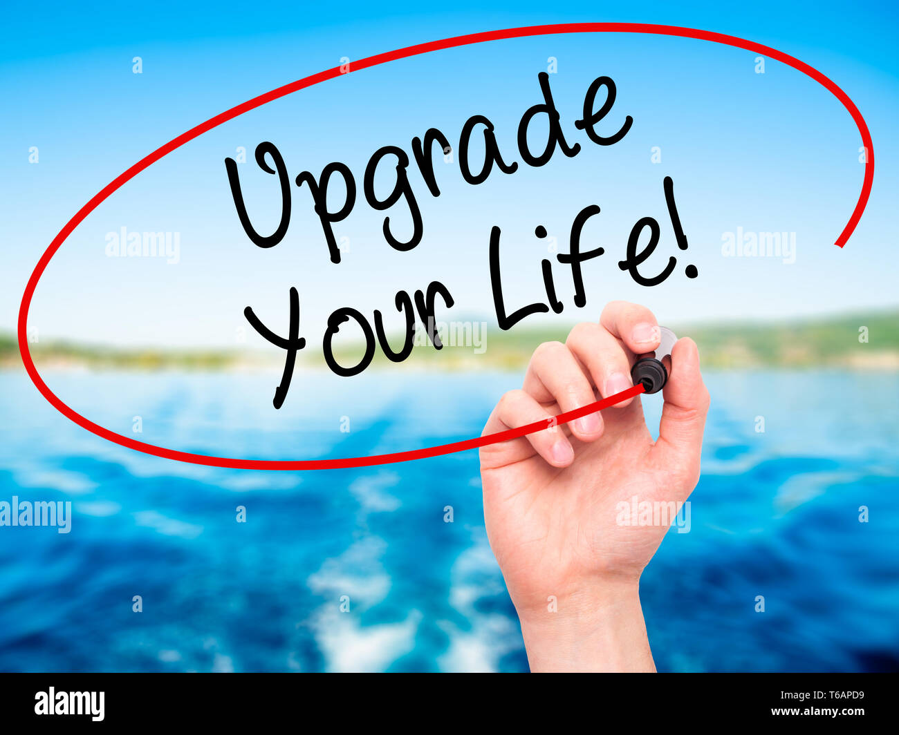 Man Hand writing Upgrade Your Life! with black marker on visual screen ...