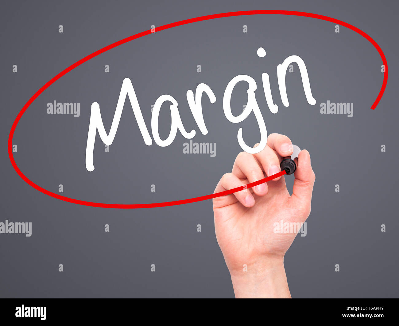 Man Hand writing Margin with black marker on visual screen Stock Photo ...