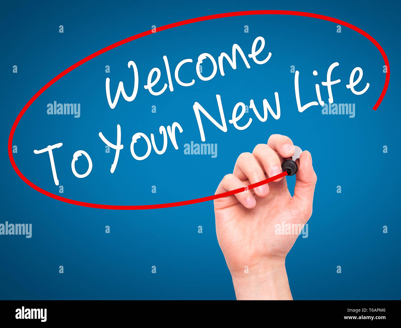 Man Hand writing Welcome To Your New Life with black marker on visual ...