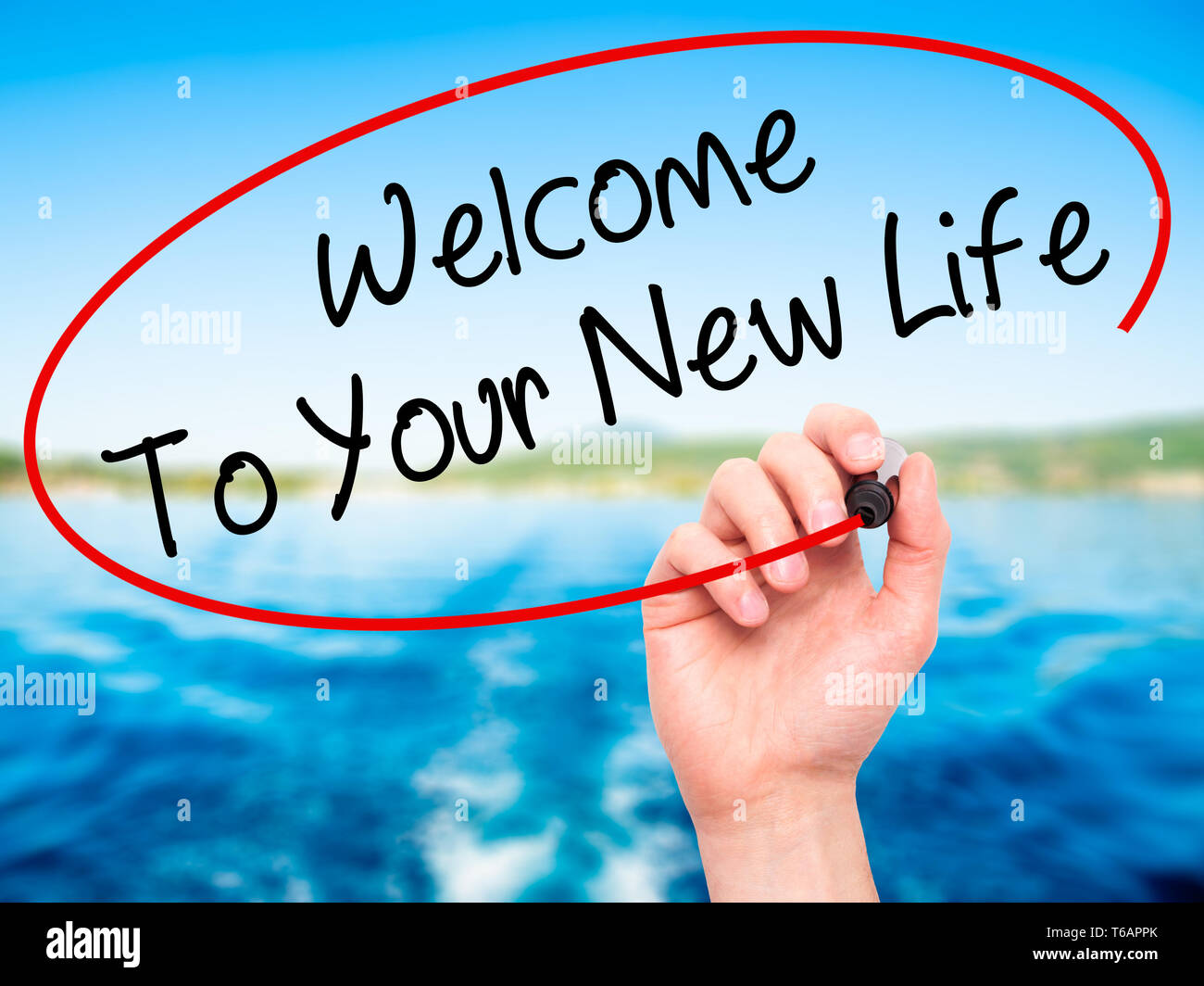 Man Hand writing Welcome To Your New Life with black marker on visual ...
