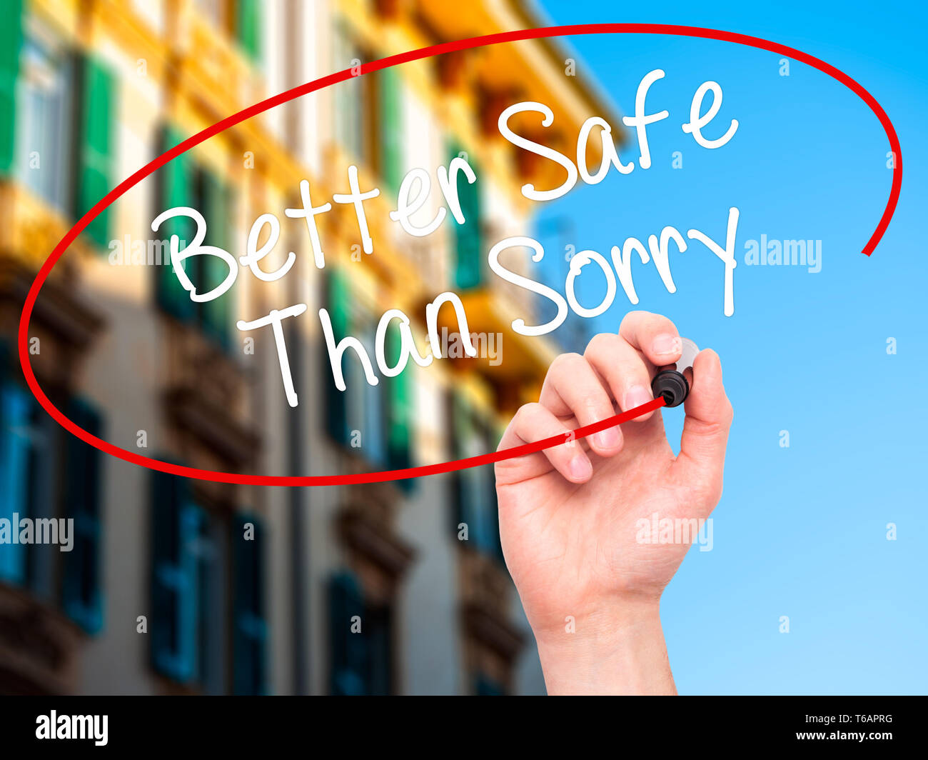 Man Hand writing Better Safe Than Sorry with black marker on visual ...