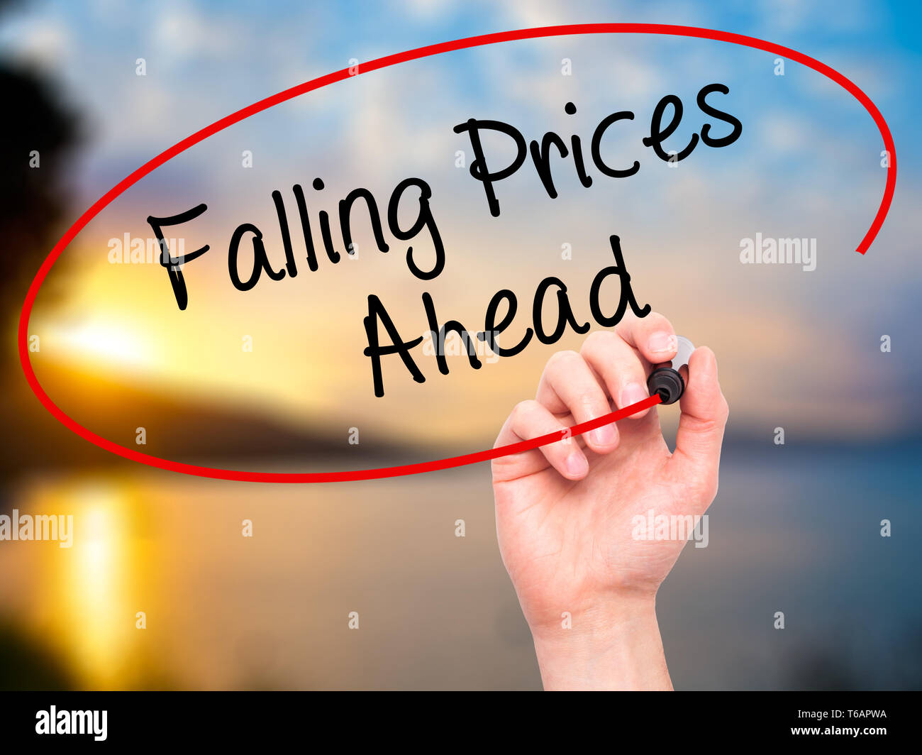 Man Hand writing Falling Prices Ahead with black marker on visual ...