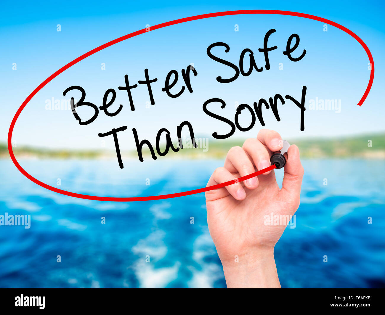 Man Hand writing Better Safe Than Sorry with black marker on visual ...