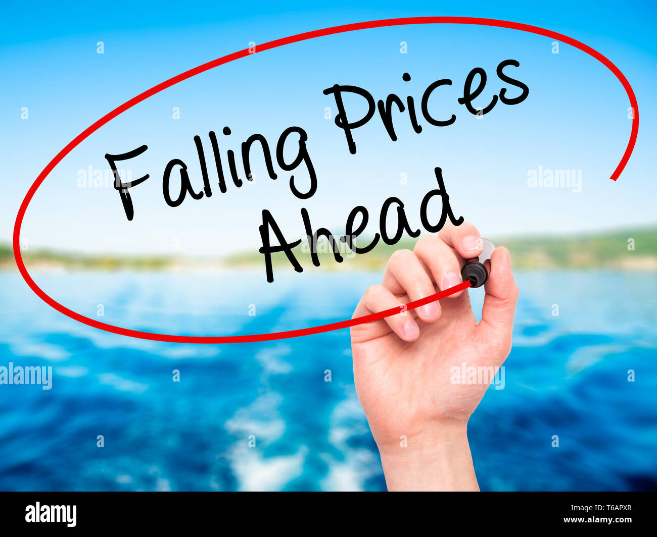 Man Hand writing Falling Prices Ahead with black marker on visual ...
