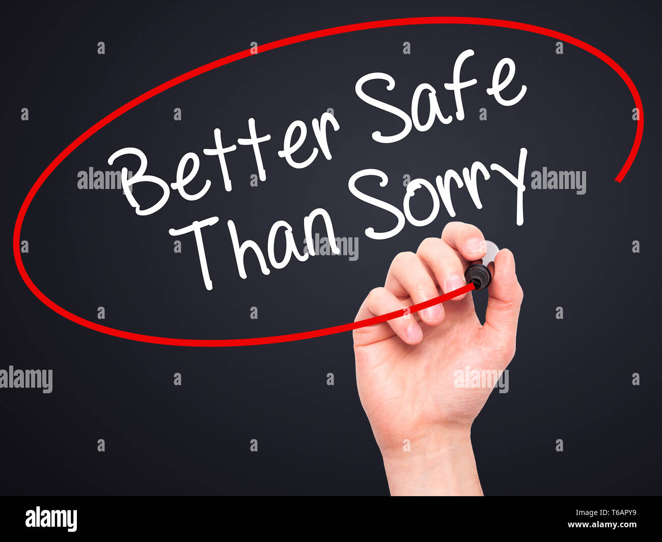 Man Hand writing Better Safe Than Sorry with black marker on visual ...