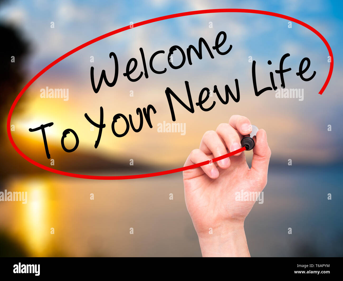 Man Hand writing Welcome To Your New Life with black marker on visual ...