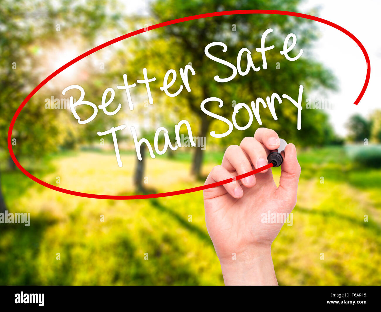 Man Hand writing Better Safe Than Sorry with black marker on visual ...
