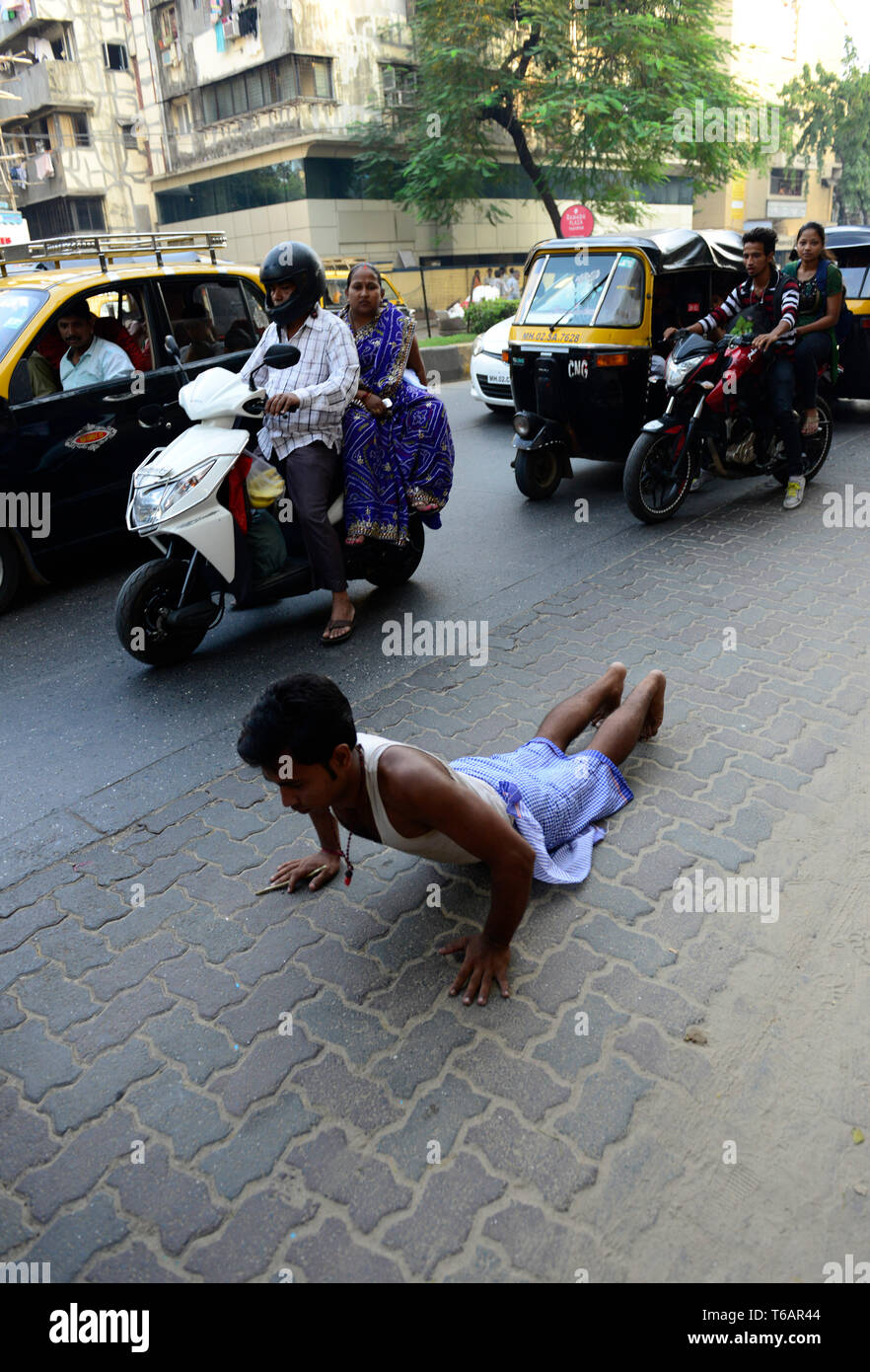 Hindu devotees prostrating their way to Juhu beach for the Chhath Pujia ...