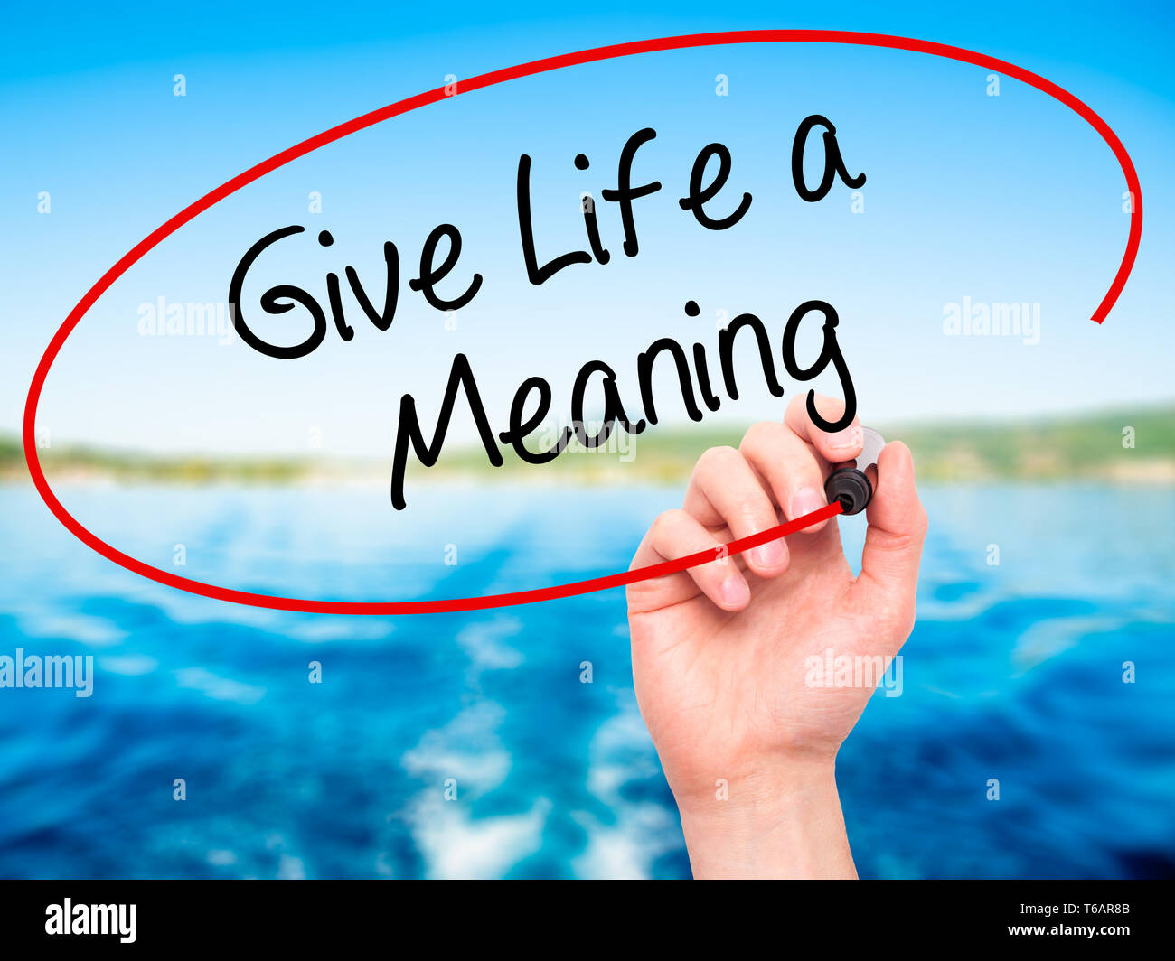 Man Hand writing Give Life a Meaning with black marker on visual screen ...