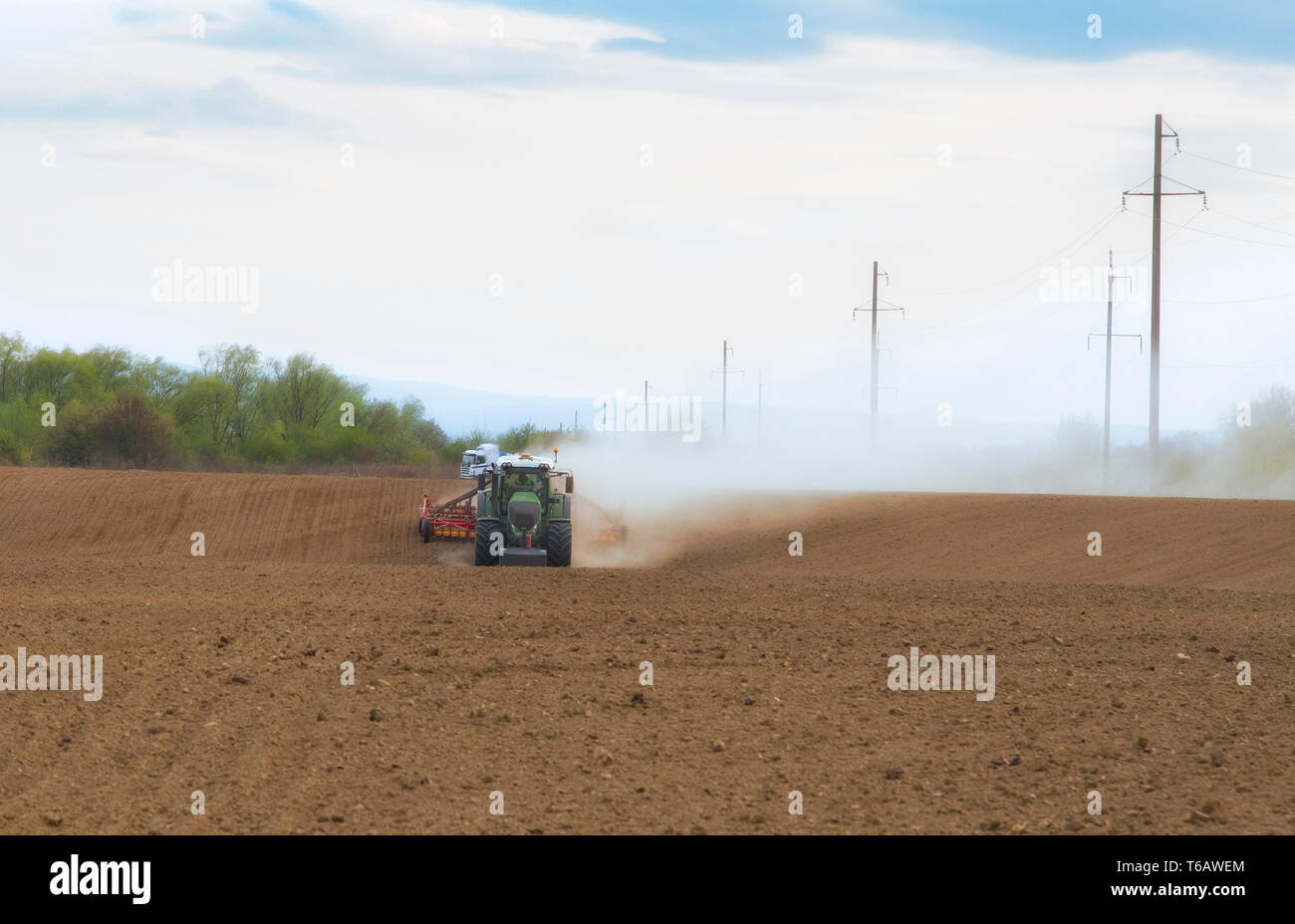 Farmer seeding, sowing crops at field. Sowing is the process of ...