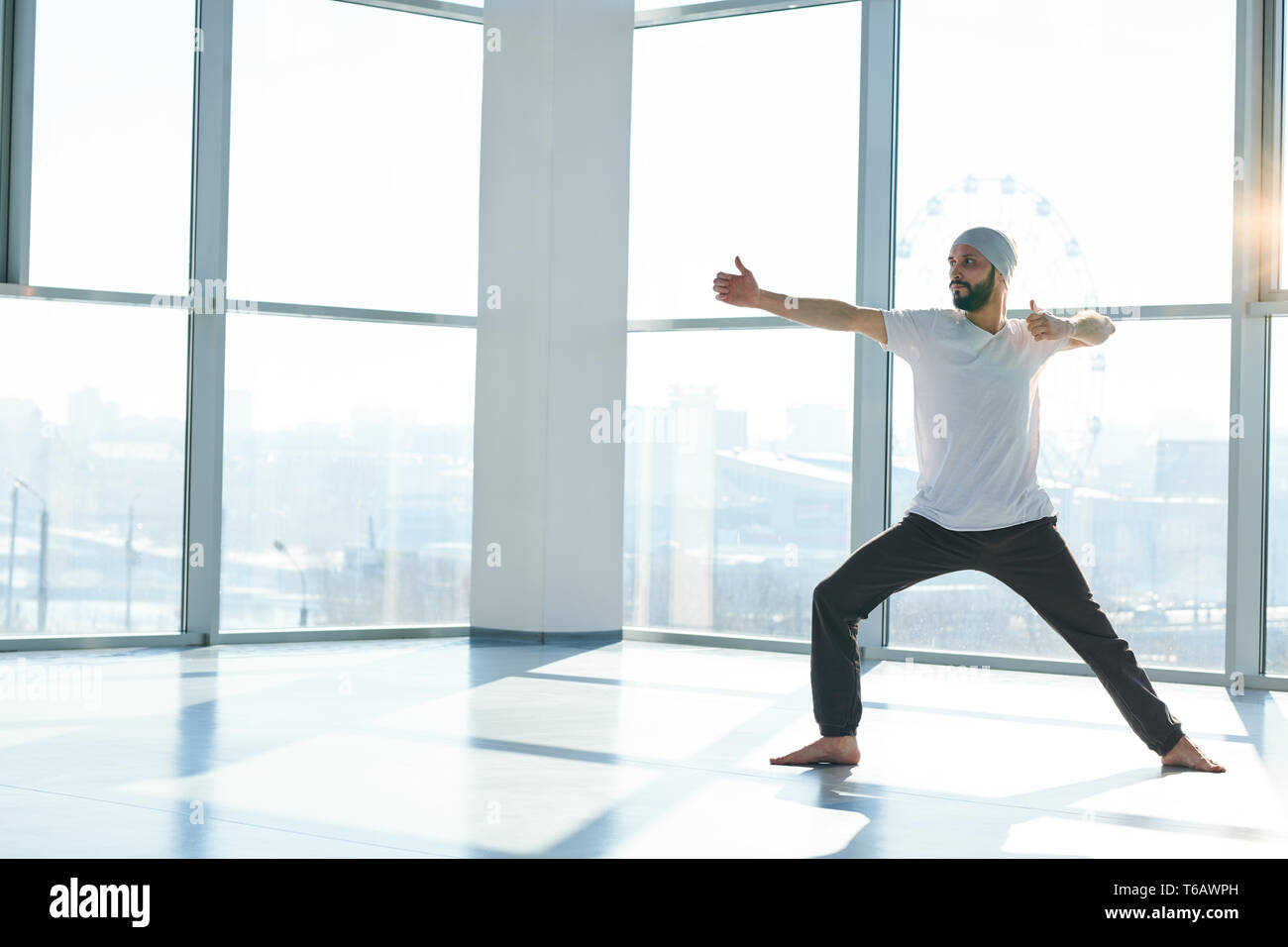Man doing yoga Stock Photo - Alamy