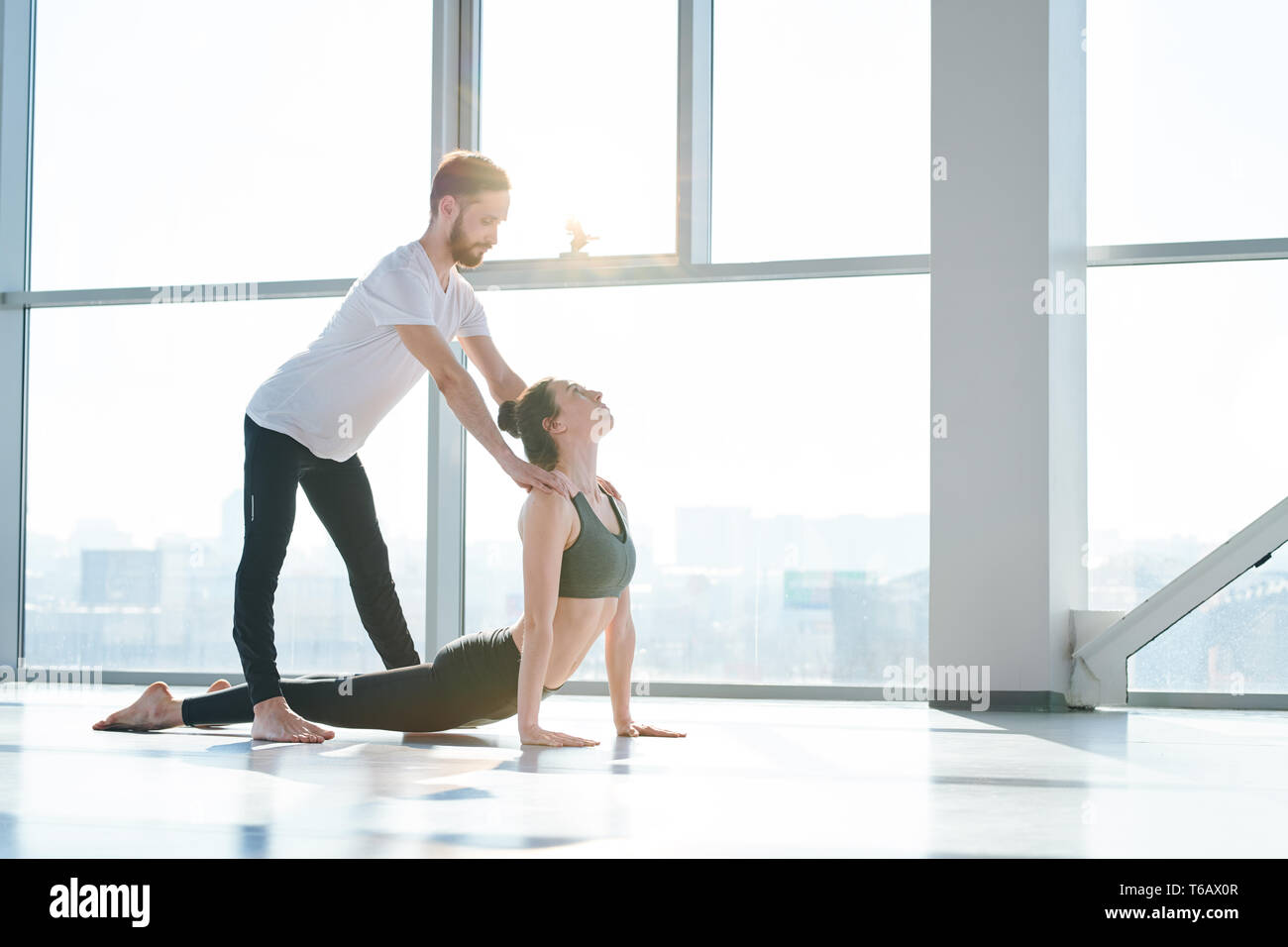Balancing on the floor Stock Photo - Alamy
