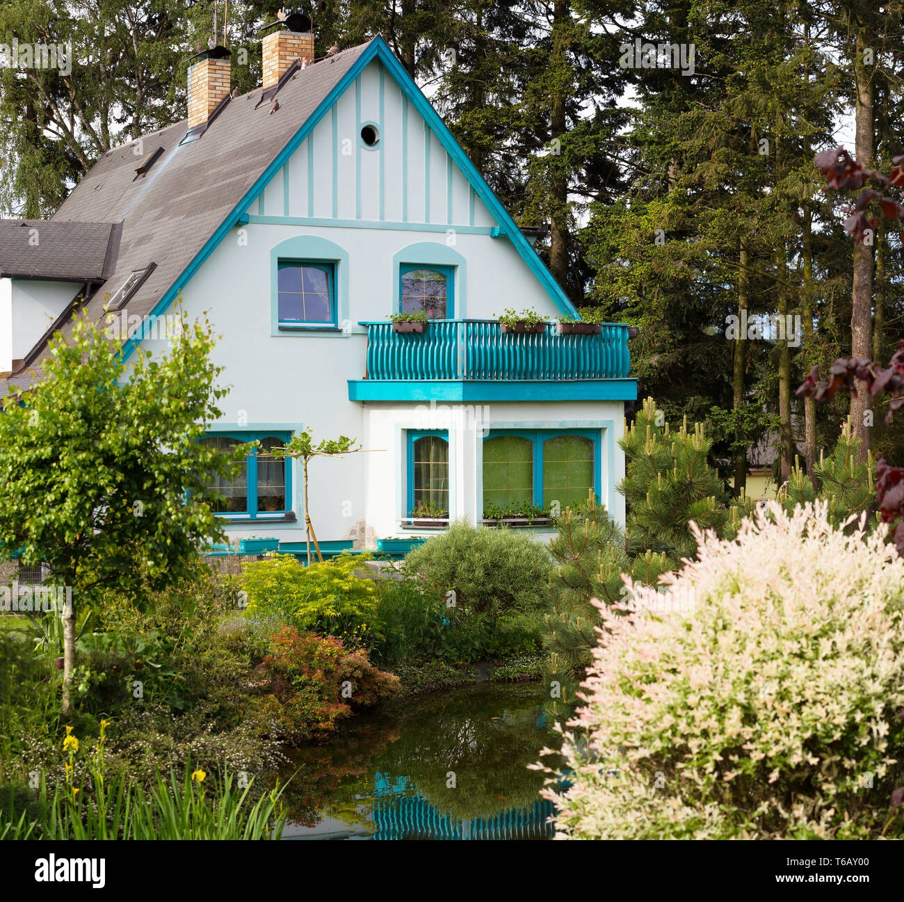 Beautiful house in spring garden Stock Photo - Alamy