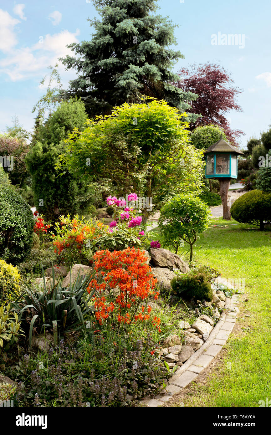 Beautiful spring garden design Stock Photo - Alamy