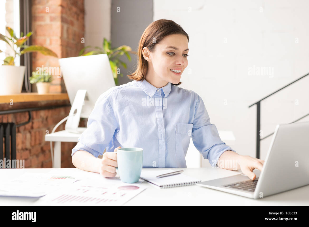 Pretty employee at work Stock Photo - Alamy