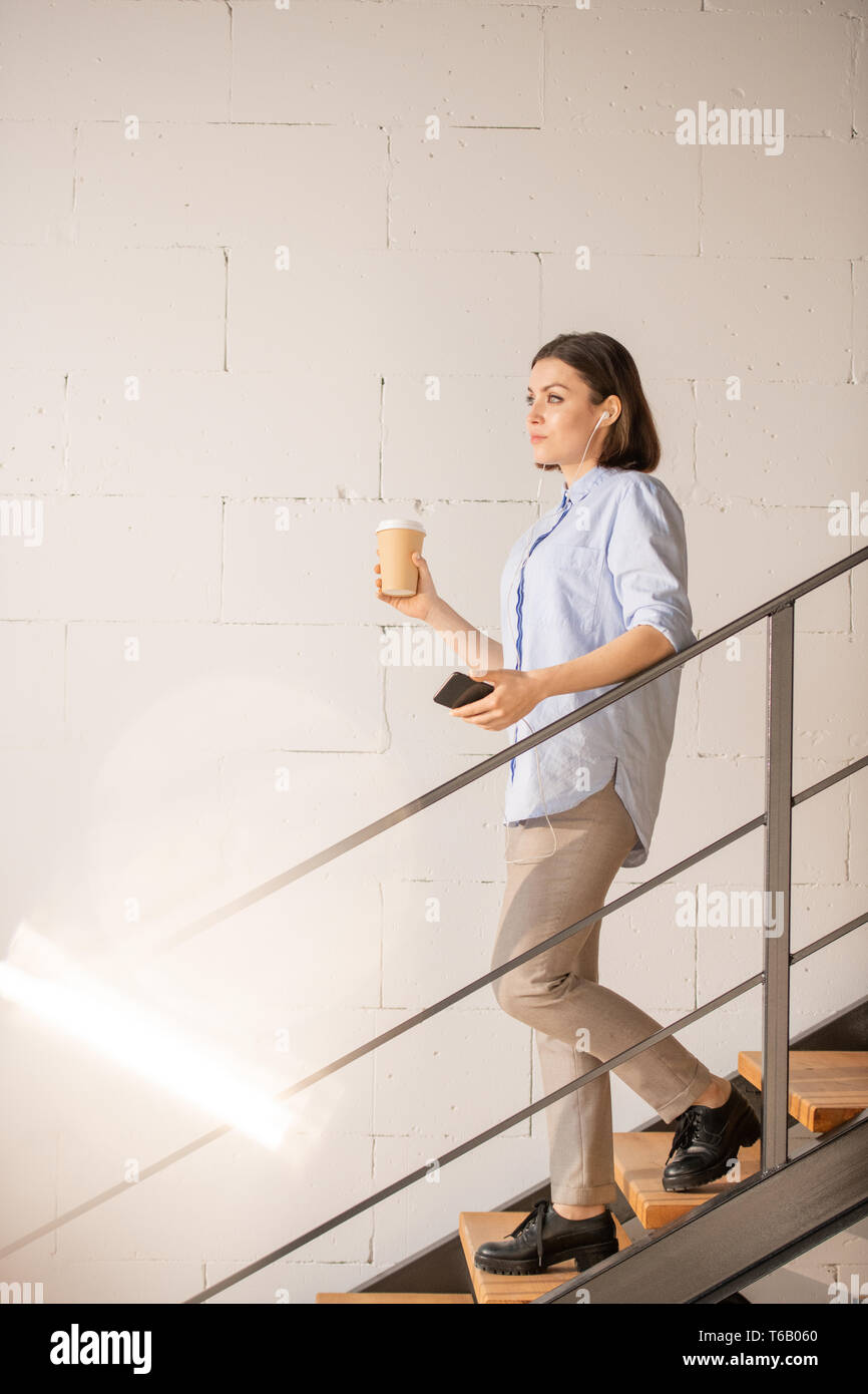 Woman downstairs hi-res stock photography and images - Alamy