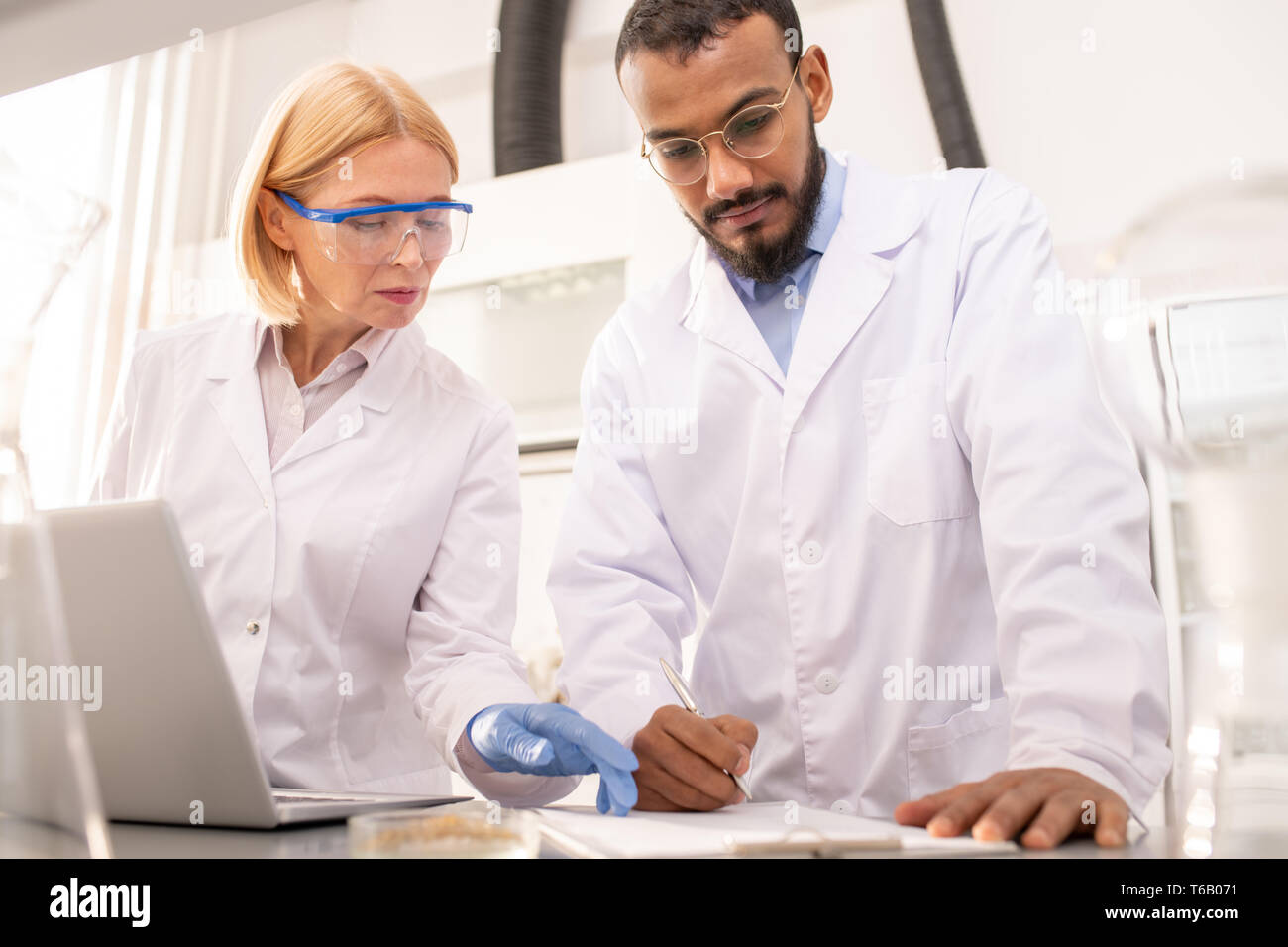 Making observation in laboratory Stock Photo - Alamy