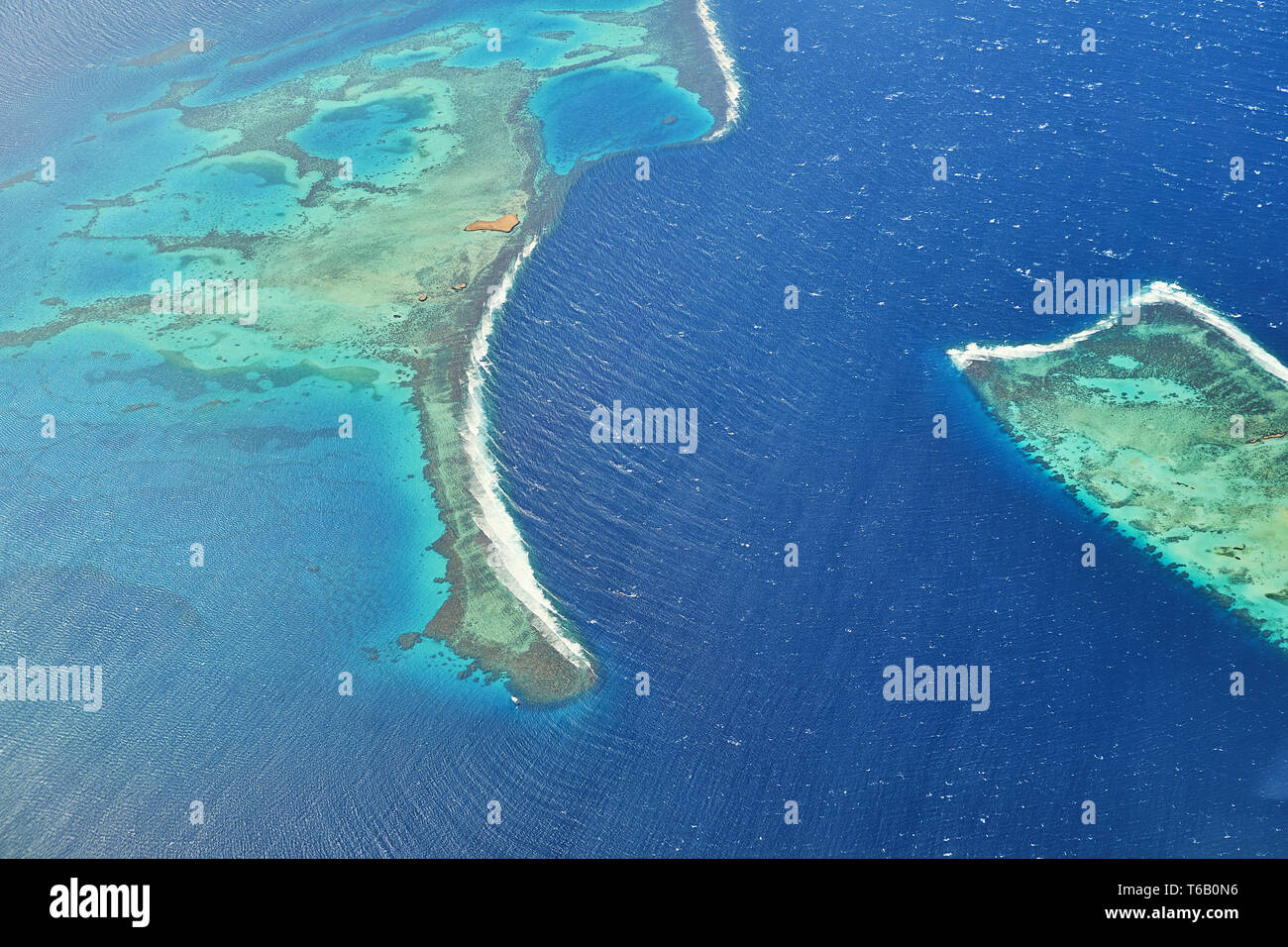 Aerial view of a beautiful turquoise coral reef, a popular night or ...