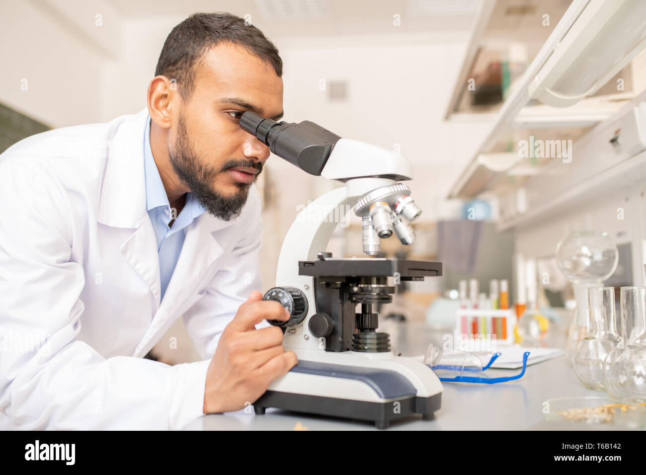 Researcher working with microscope Stock Photo - Alamy