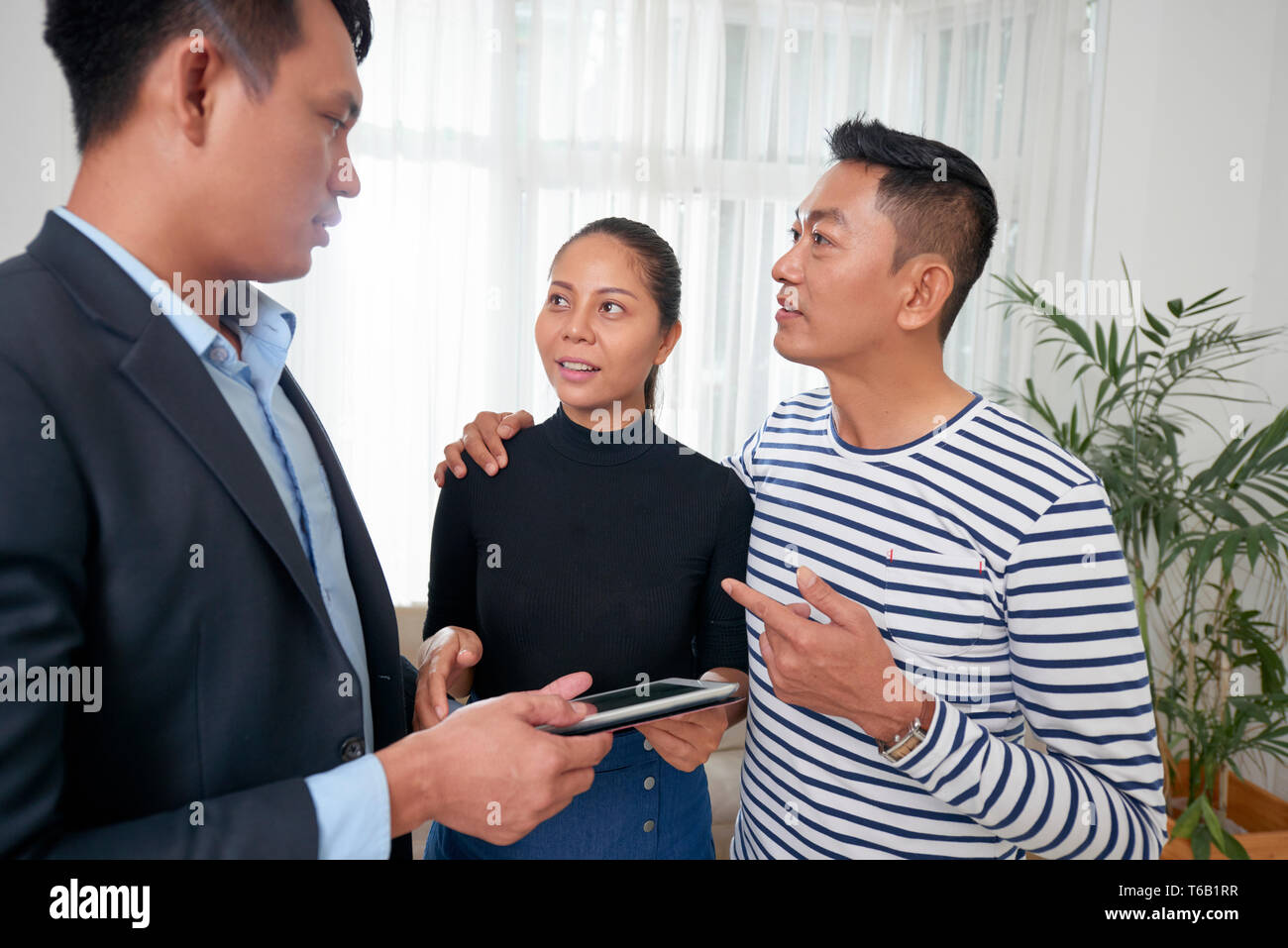 Real estate agent client discussing hi-res stock photography and images ...