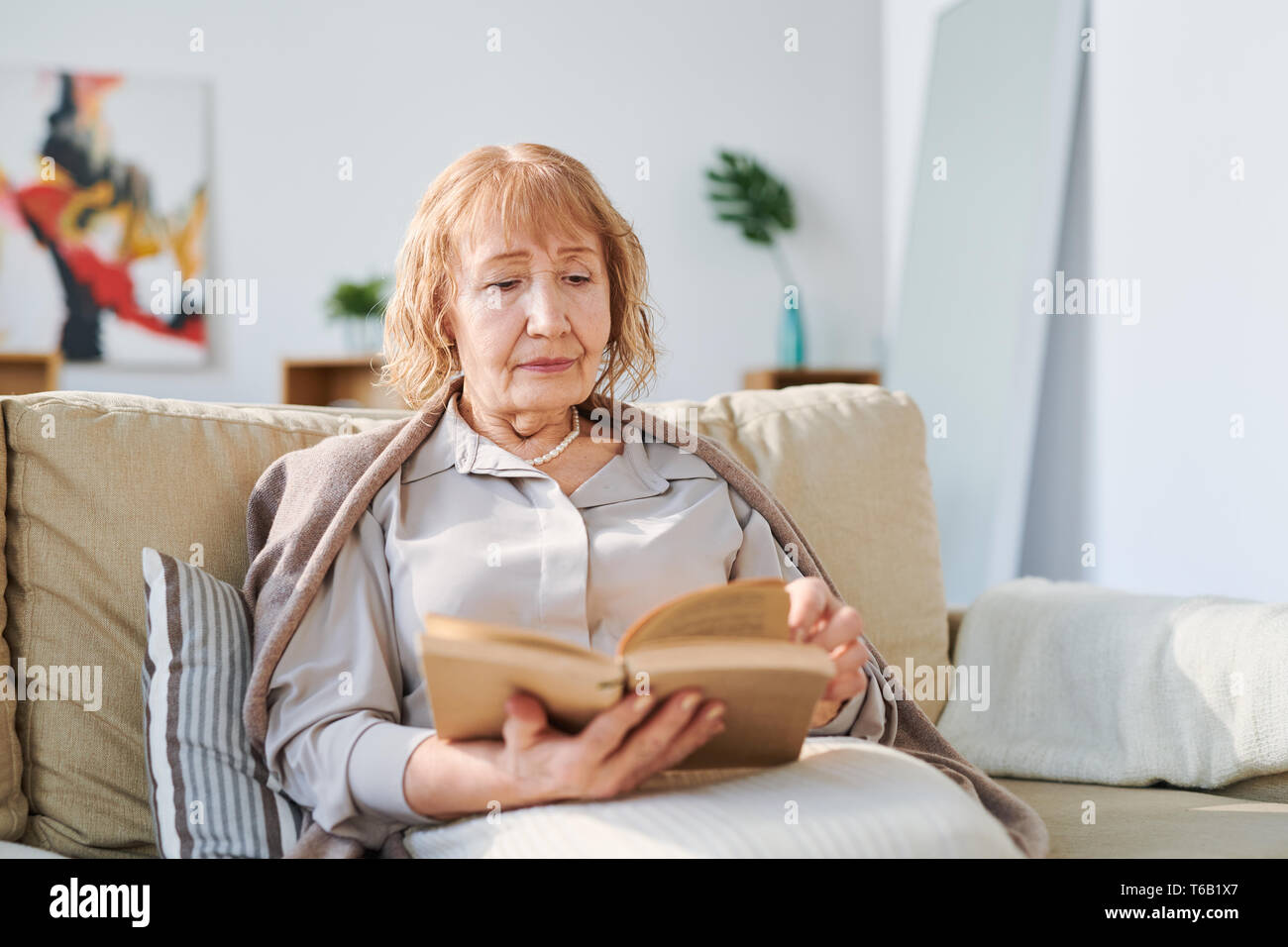 Reading at home Stock Photo - Alamy