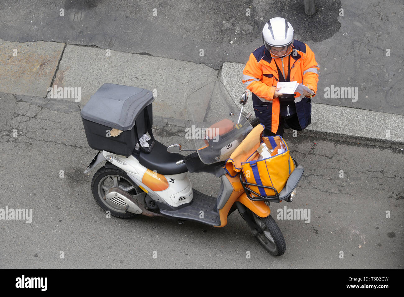 Milan (Italy), postman at work Stock Photo - Alamy