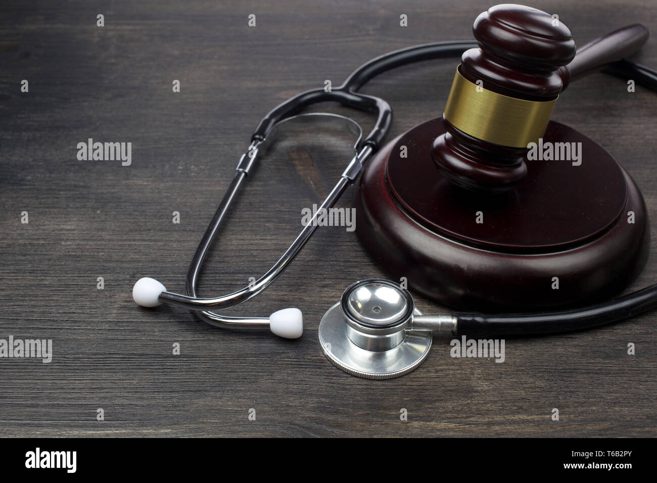 Wooden gavel with black stethoscope hi-res stock photography and images ...