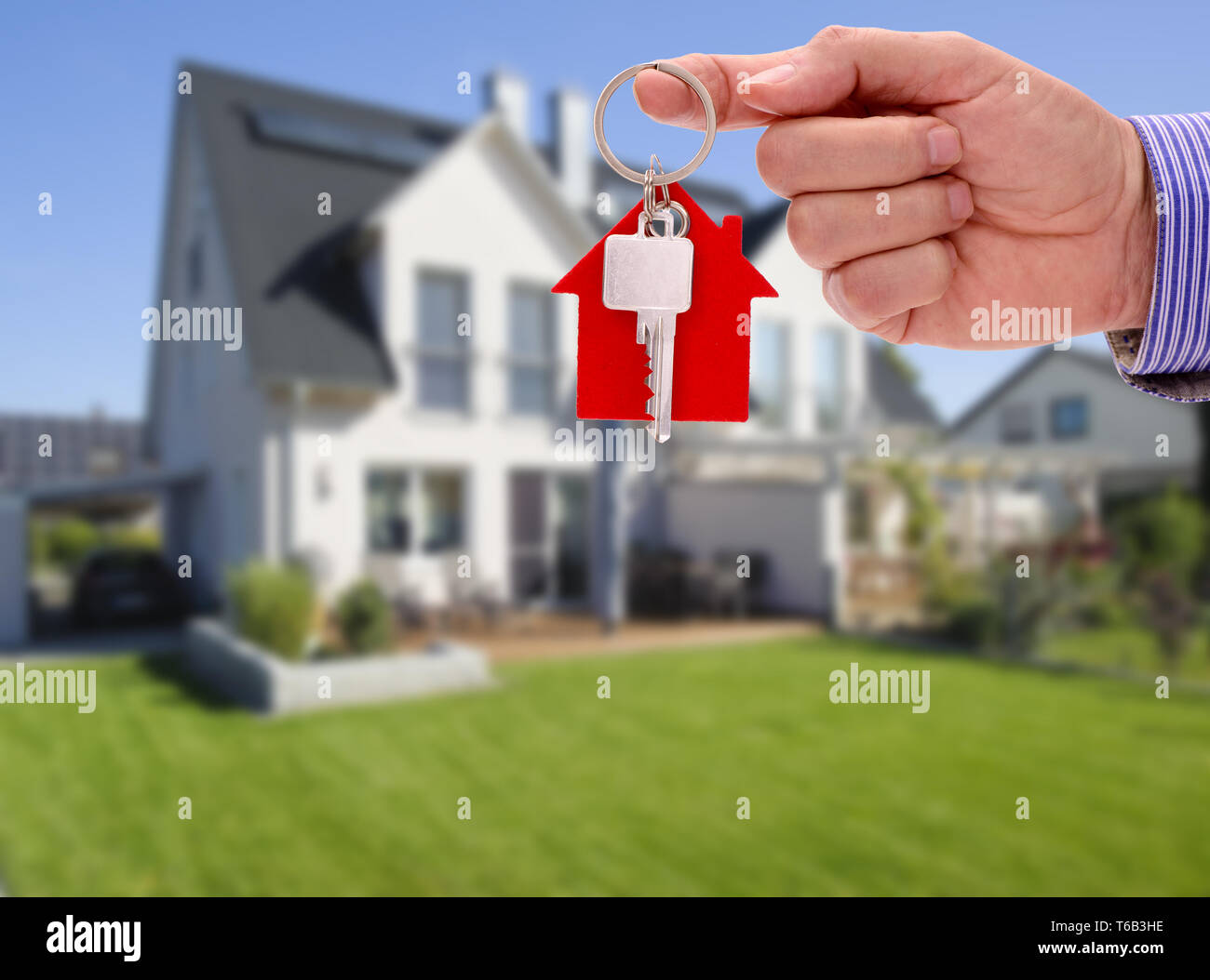 key in hand for new home and real estate Stock Photo - Alamy