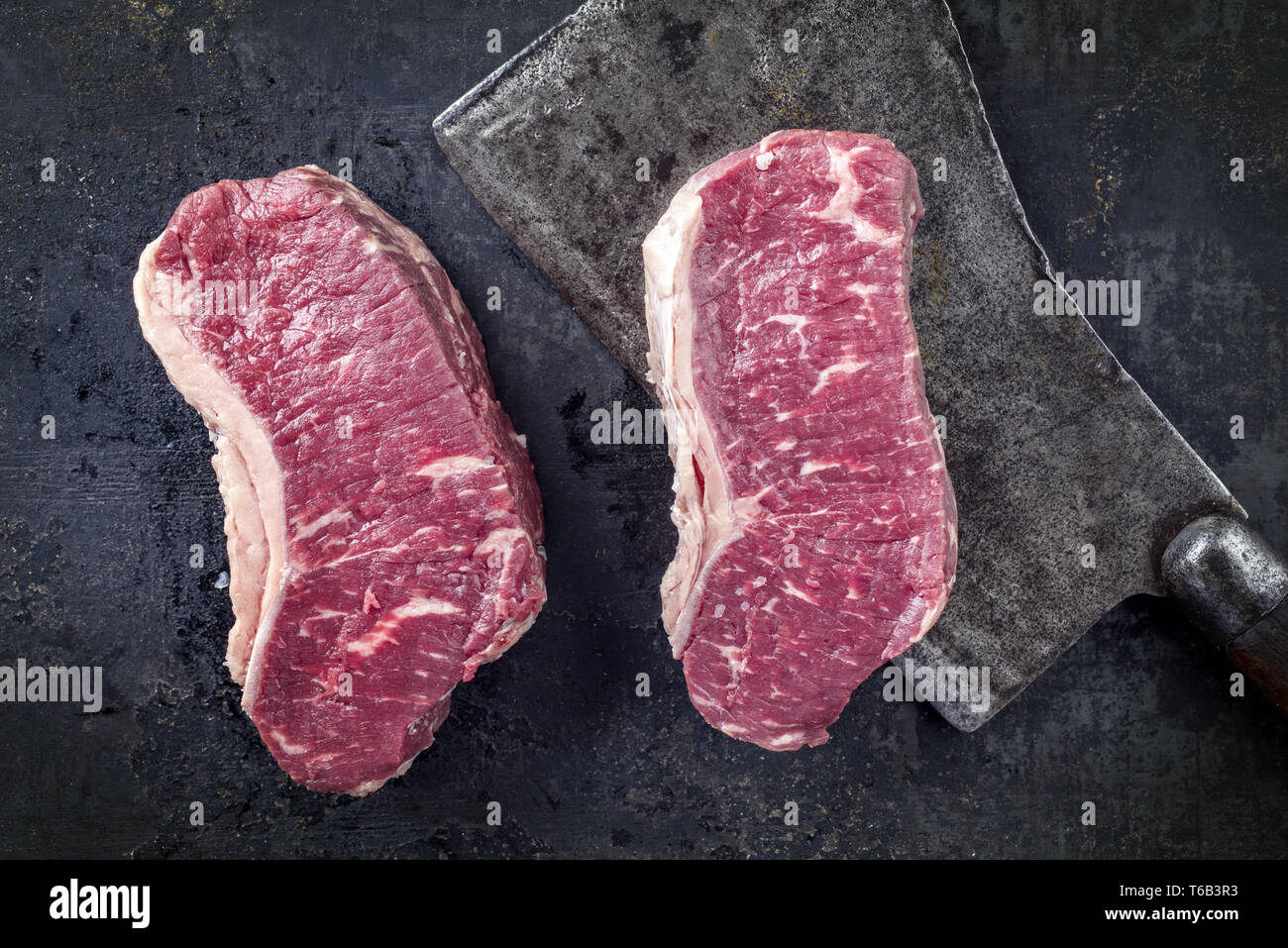 Dry Aged Roast Beef with Kitchen Cleaver on old Metal Sheet Stock Photo ...
