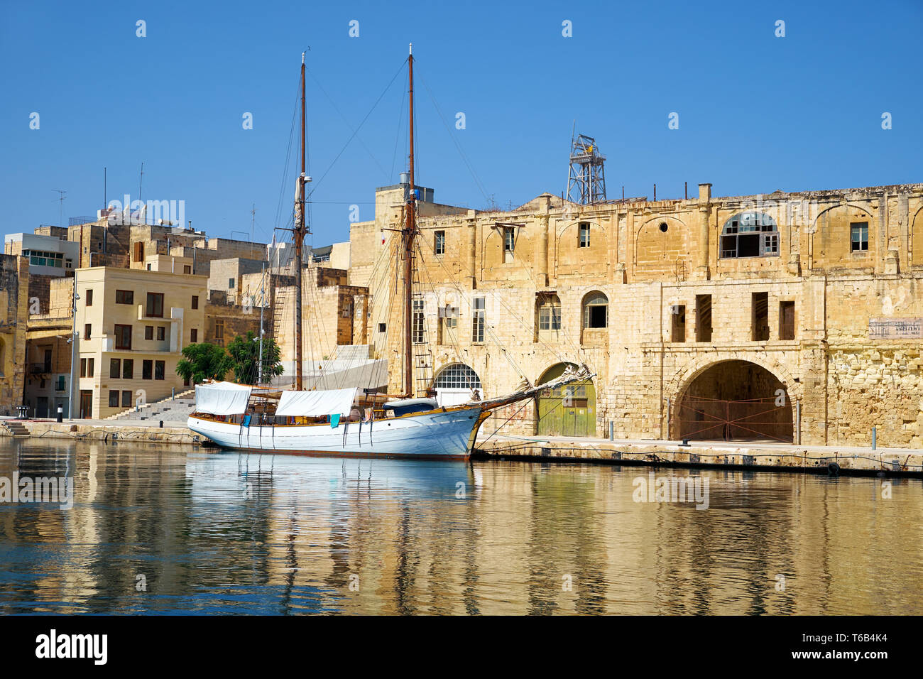 The yacht moored at the pier near the old dock. Malta Stock Photo - Alamy