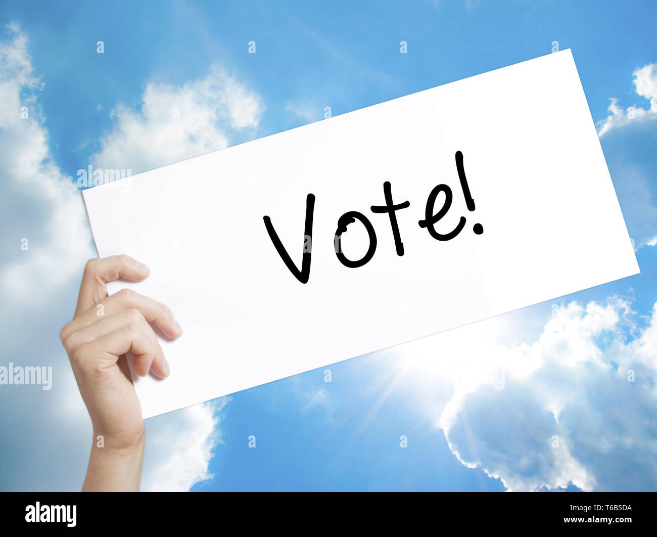 Vote! Sign on white paper. Man Hand Holding Paper with text. Isolated ...