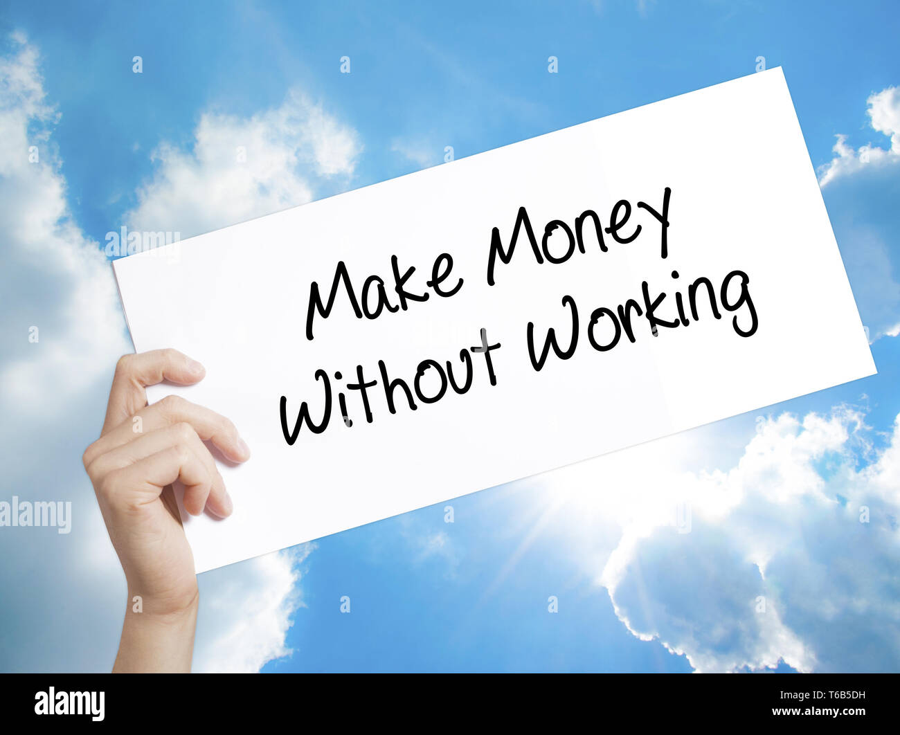 Make Money Without Working Sign on white paper. Man Hand Holding Paper ... Make Money Without Working Sign on white paper. Man Hand Holding Paper ...